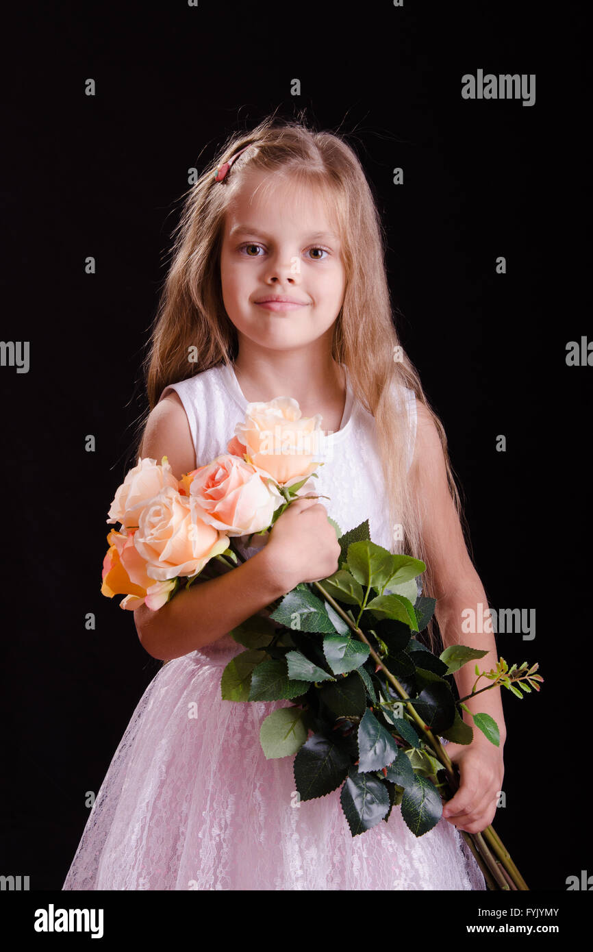 Happy five year old girl with a bouquet of flowers Stock Photo - Alamy
