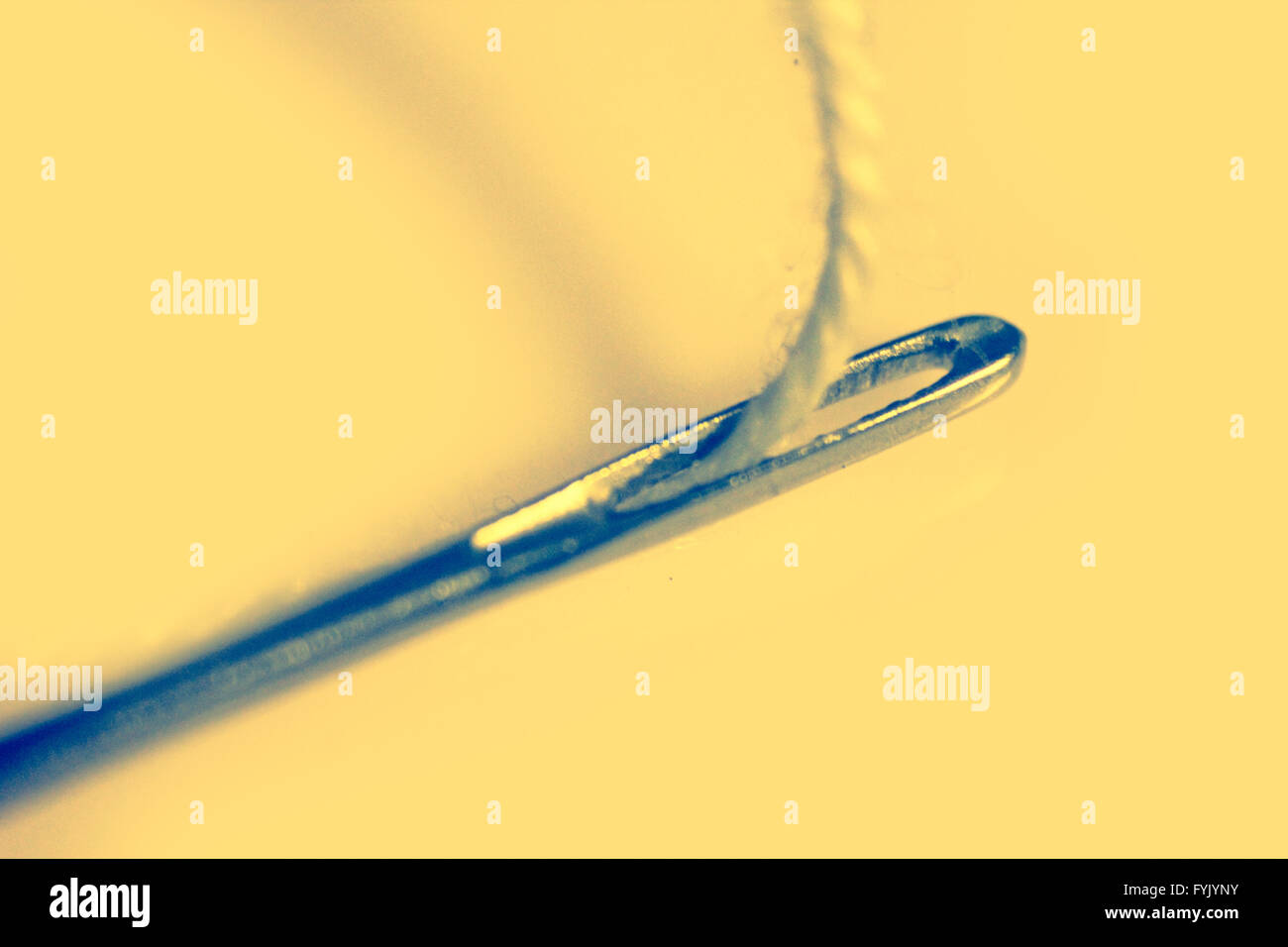 Needle with thread Stock Photo - Alamy
