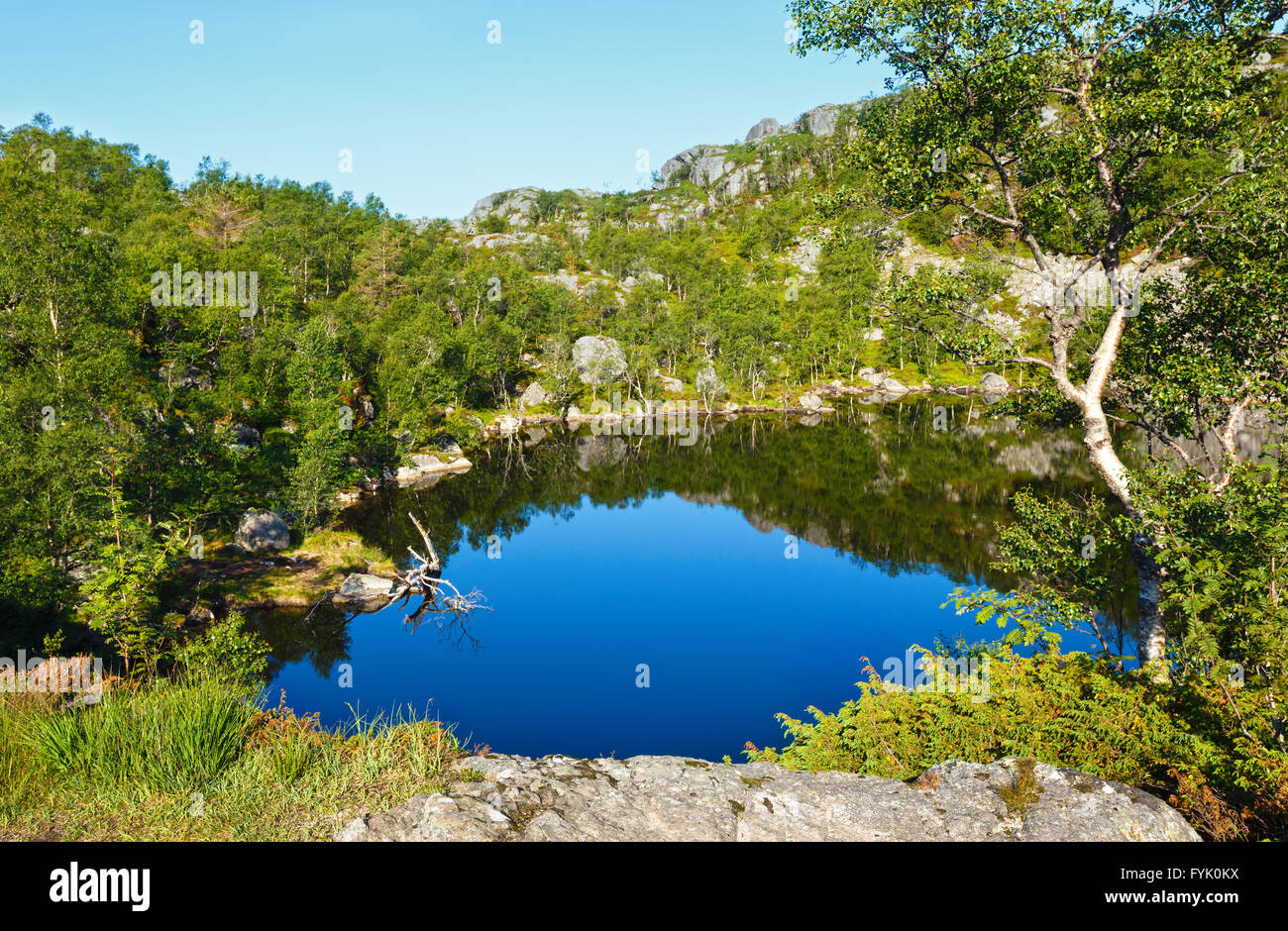 Deep blue mountain lake on Norway Stock Photo - Alamy