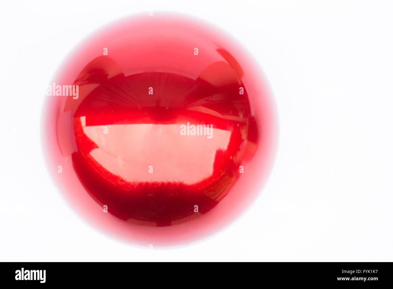 Shiny hard red ball on white background, stock photo Stock Photo - Alamy