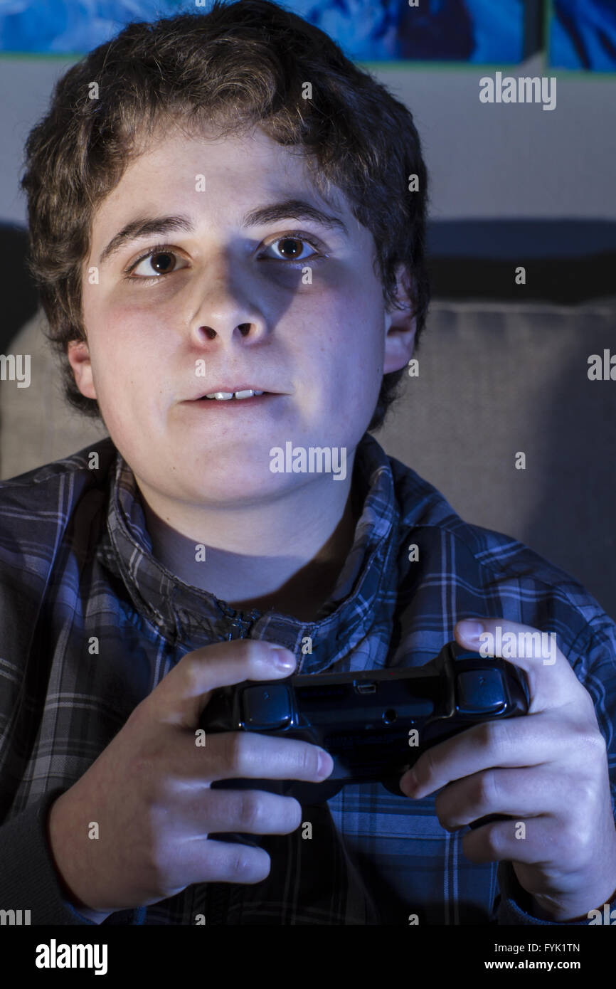 Young with joystick playing computer game at home Stock Photo - Alamy