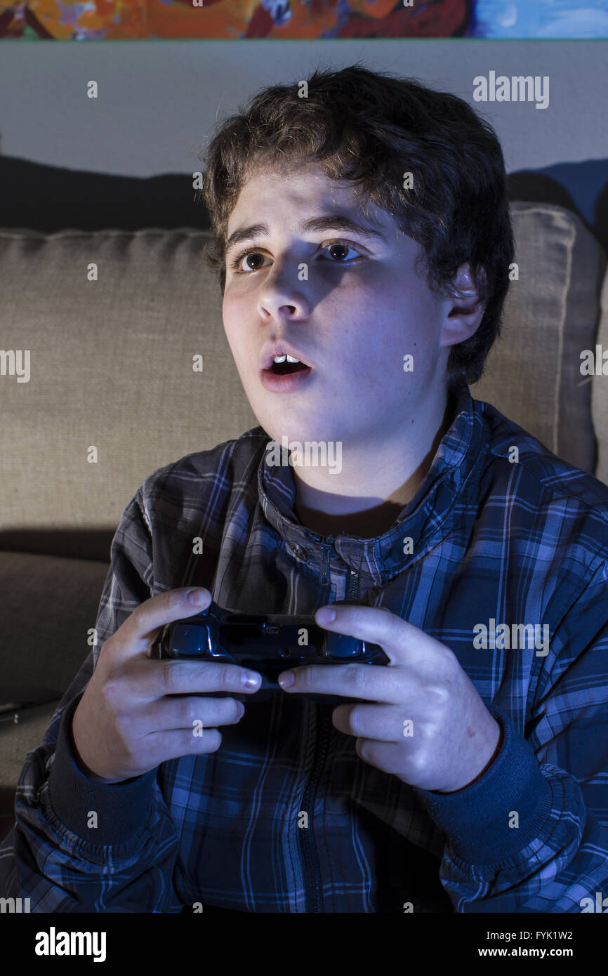 boy with joystick playing computer game at home Stock Photo - Alamy