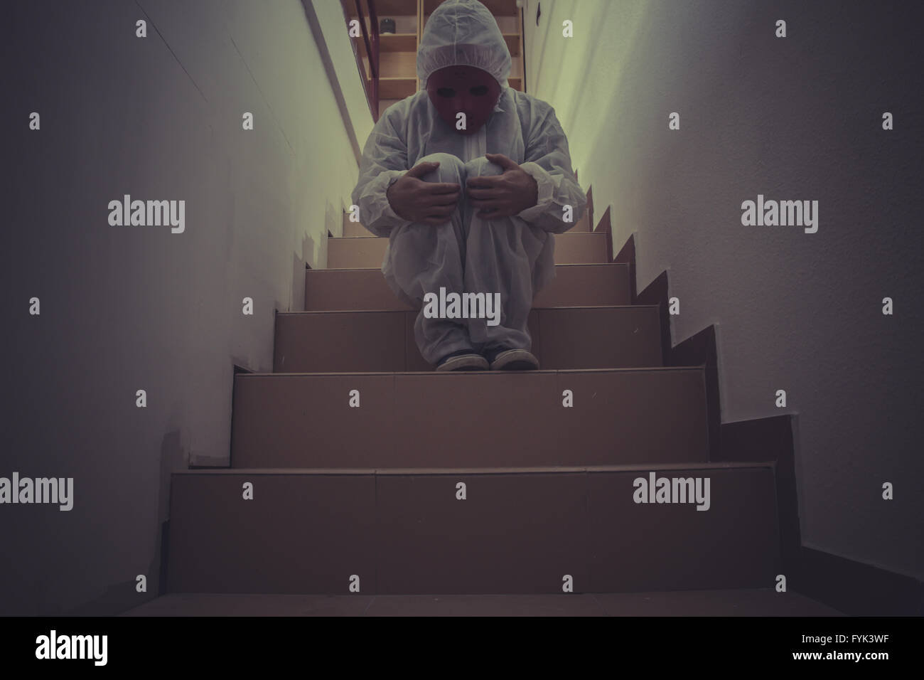 Mood, nightmare man with red mask in empty room Stock Photo - Alamy