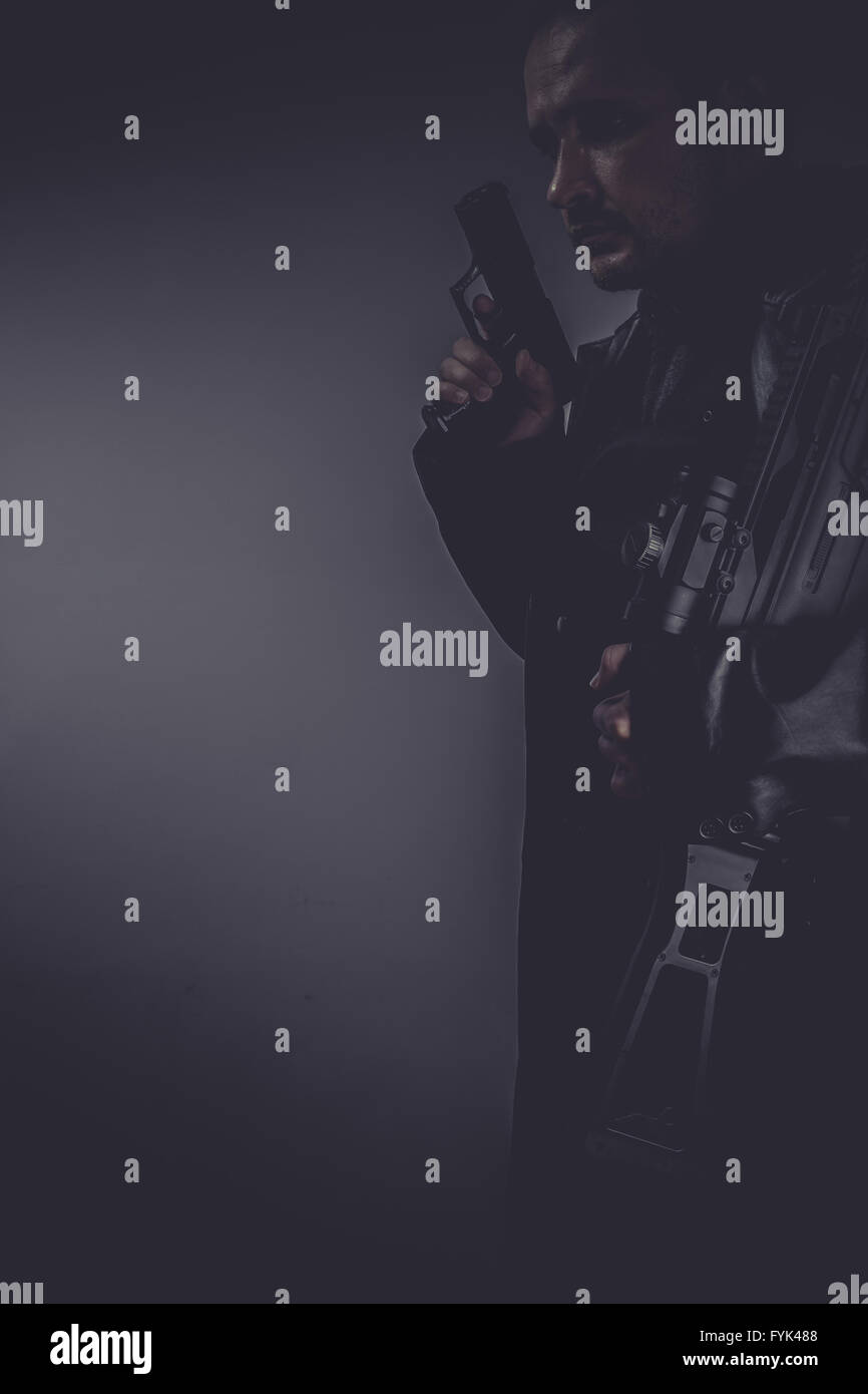 Criminal, portrait of murderer with gun Stock Photo - Alamy