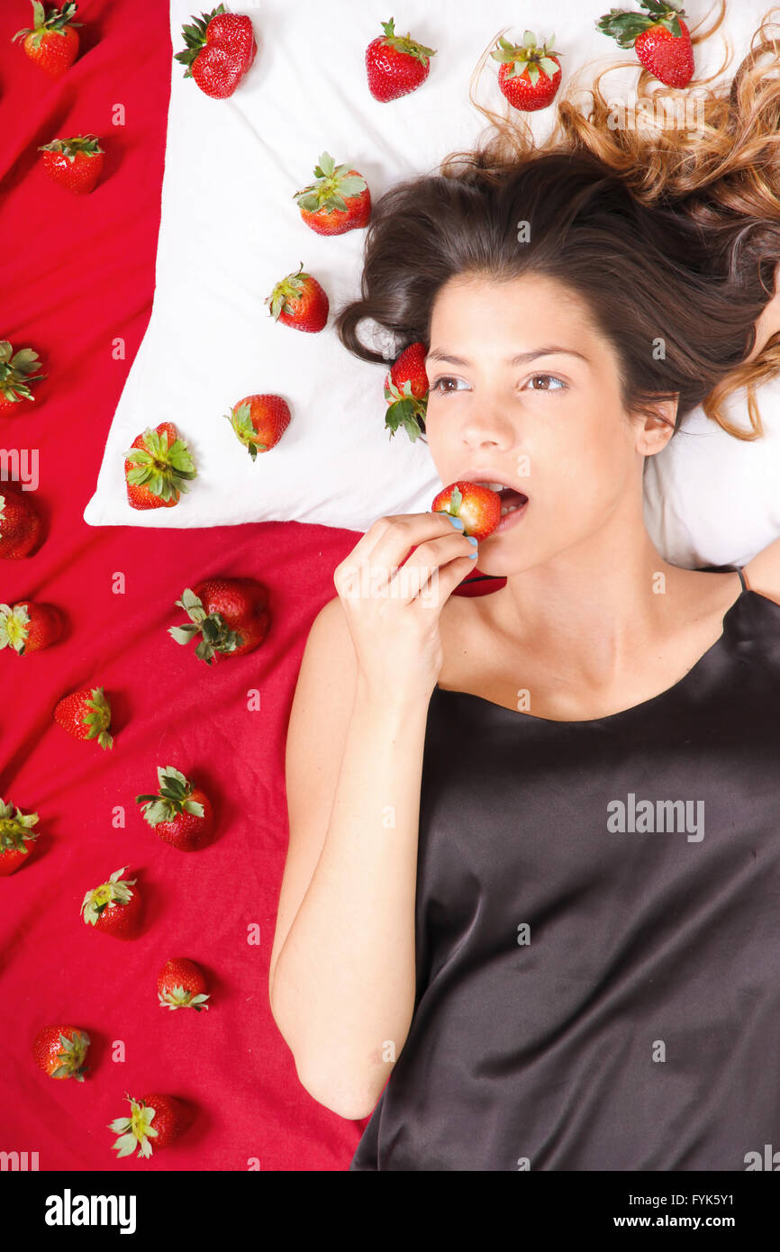 Eating a Strawberry Stock Photo - Alamy