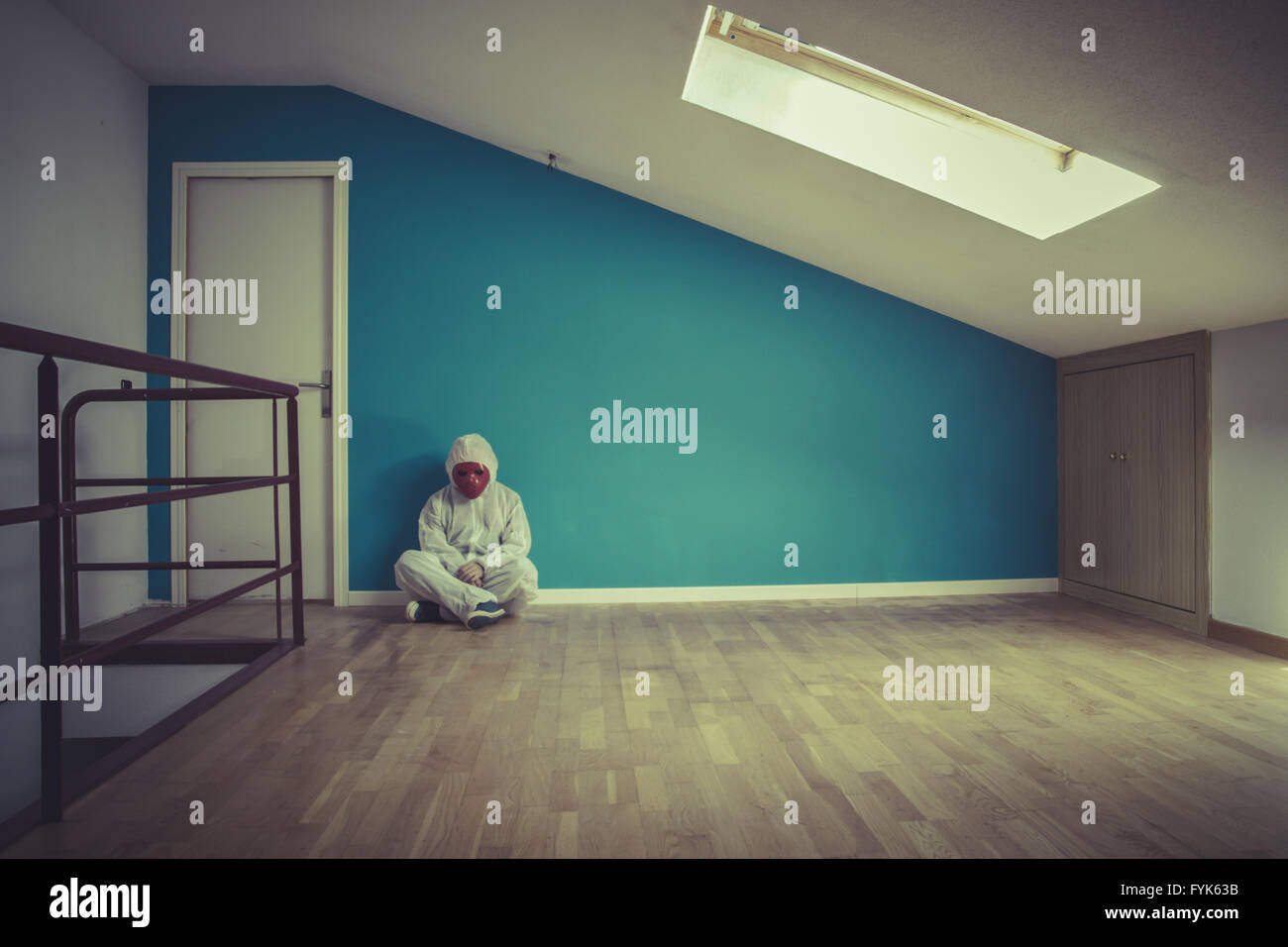 sad, nightmare man with red mask in empty room Stock Photo - Alamy