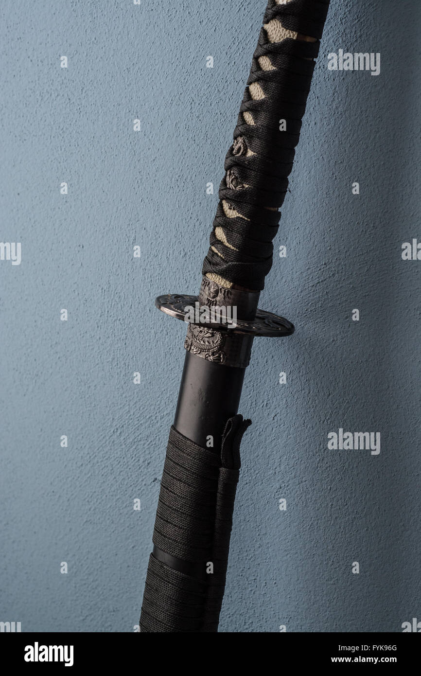 Katana laying against a wall Stock Photo - Alamy