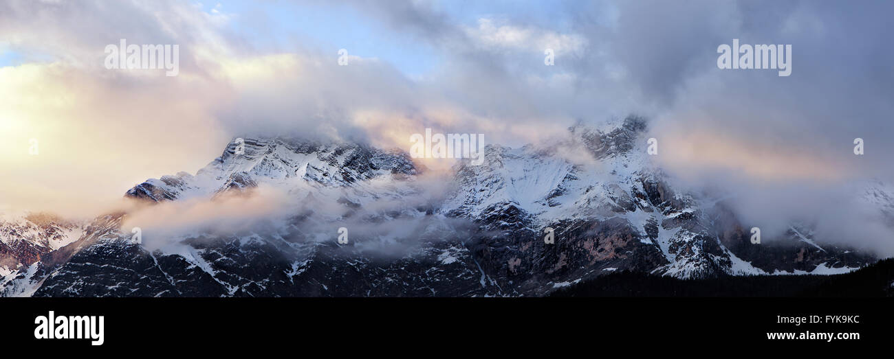 Cloudy sunrise over Dolomites mountains Stock Photo - Alamy
