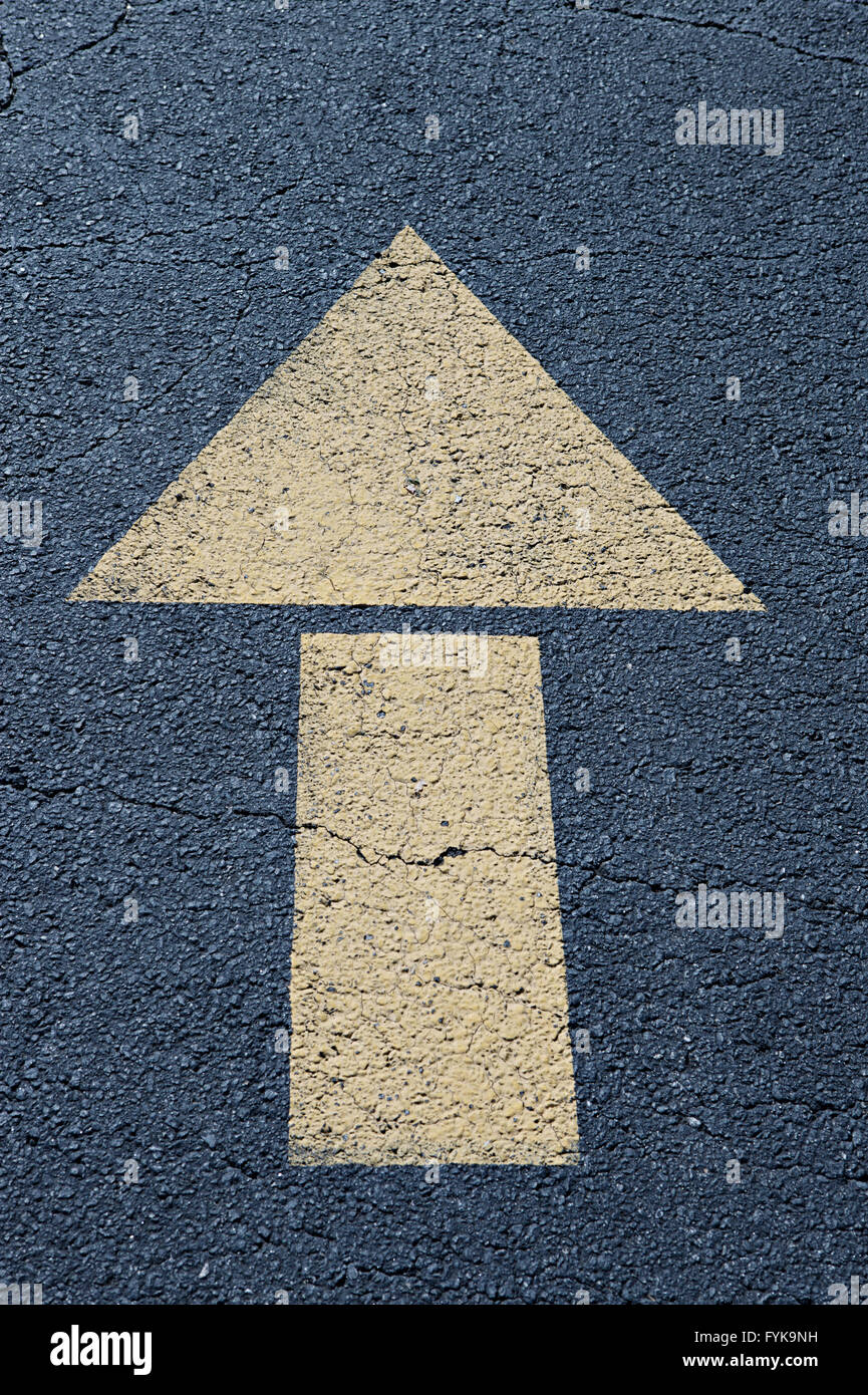 Arrow sign on the road Stock Photo - Alamy