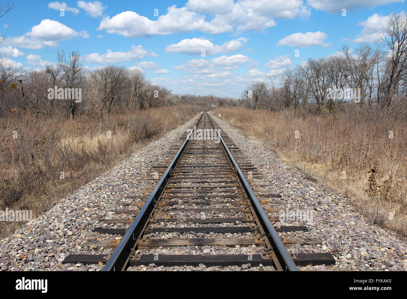 Railway to horizon and clouds on the sky background Stock Photo - Alamy