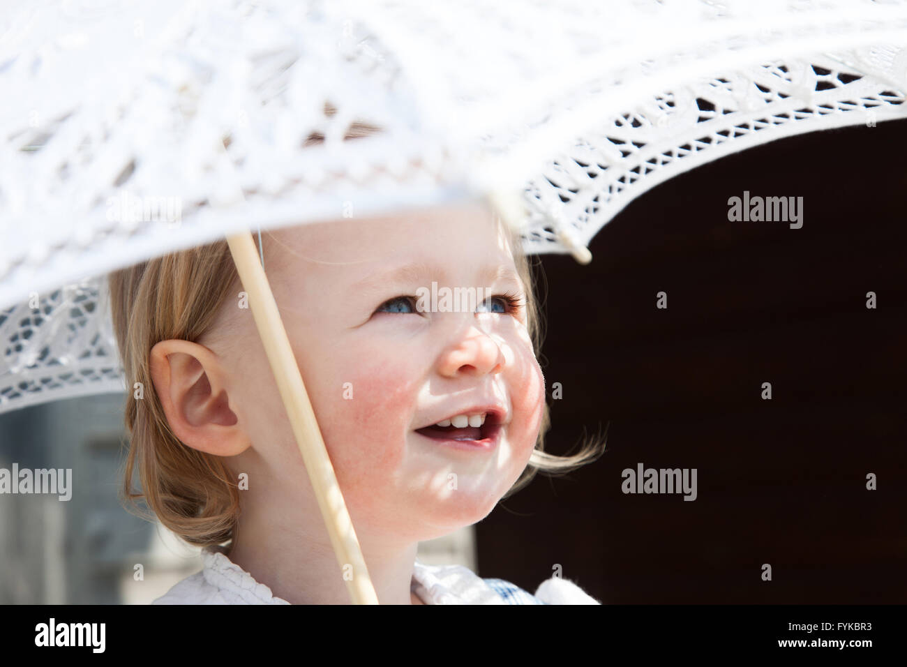 Sweet small child with umbrella Stock Photo - Alamy