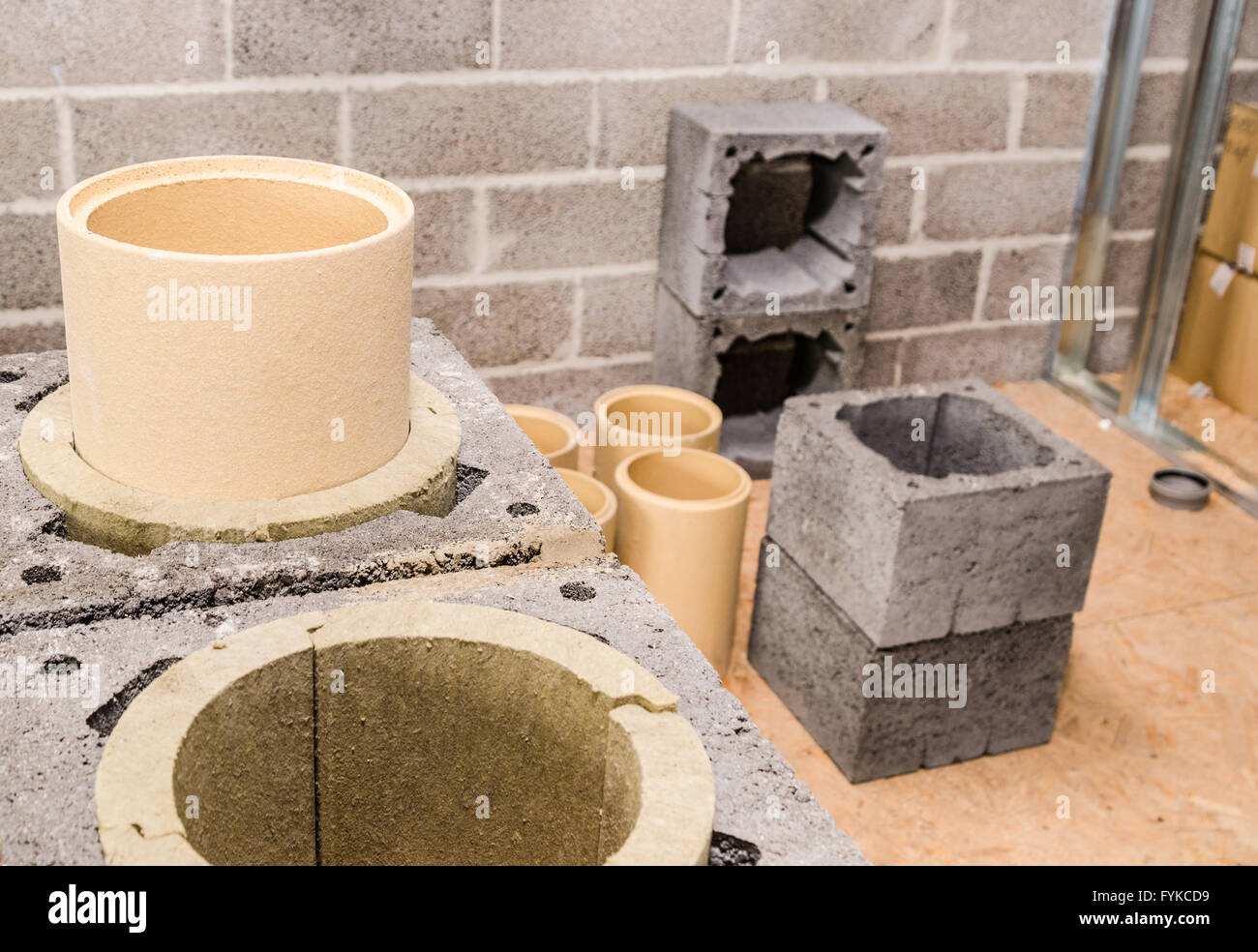 Construction of modular ceramic chimney in the house Stock Photo - Alamy