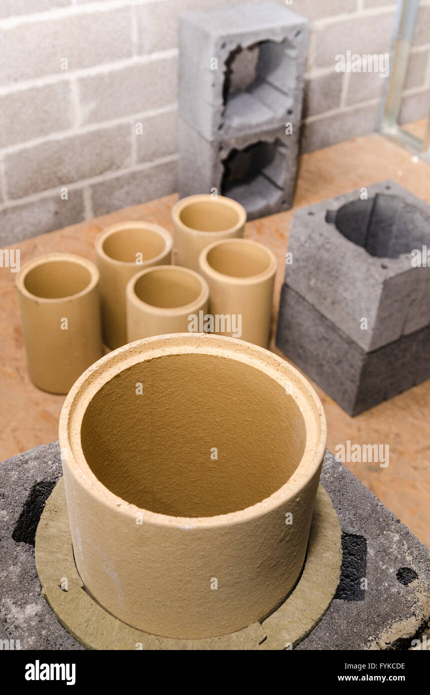 Construction of modular ceramic chimney in the house Stock Photo - Alamy