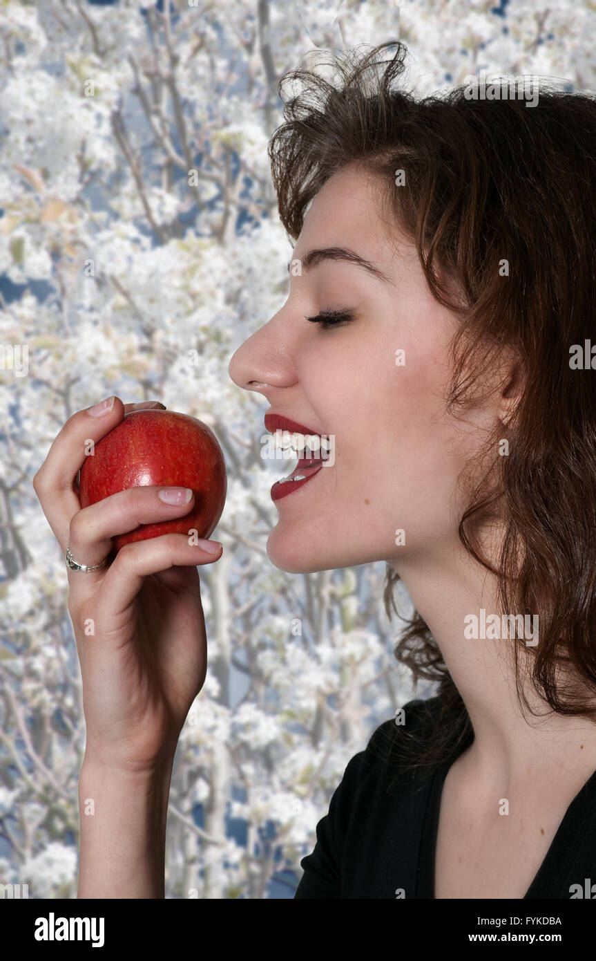 Woman Eating an Apple Stock Photo - Alamy