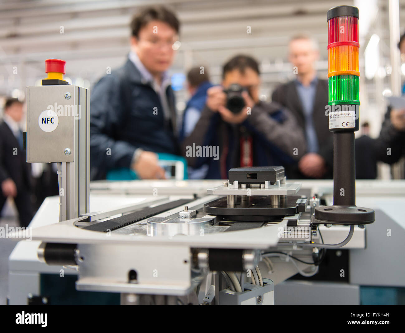 Hanover, Germany. 26th Apr, 2016. A man takes pictures of a robot at ...