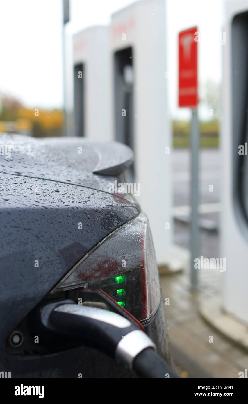 A 'Model S' car by 'Tesla' automobile manufacturers is charged at a ...