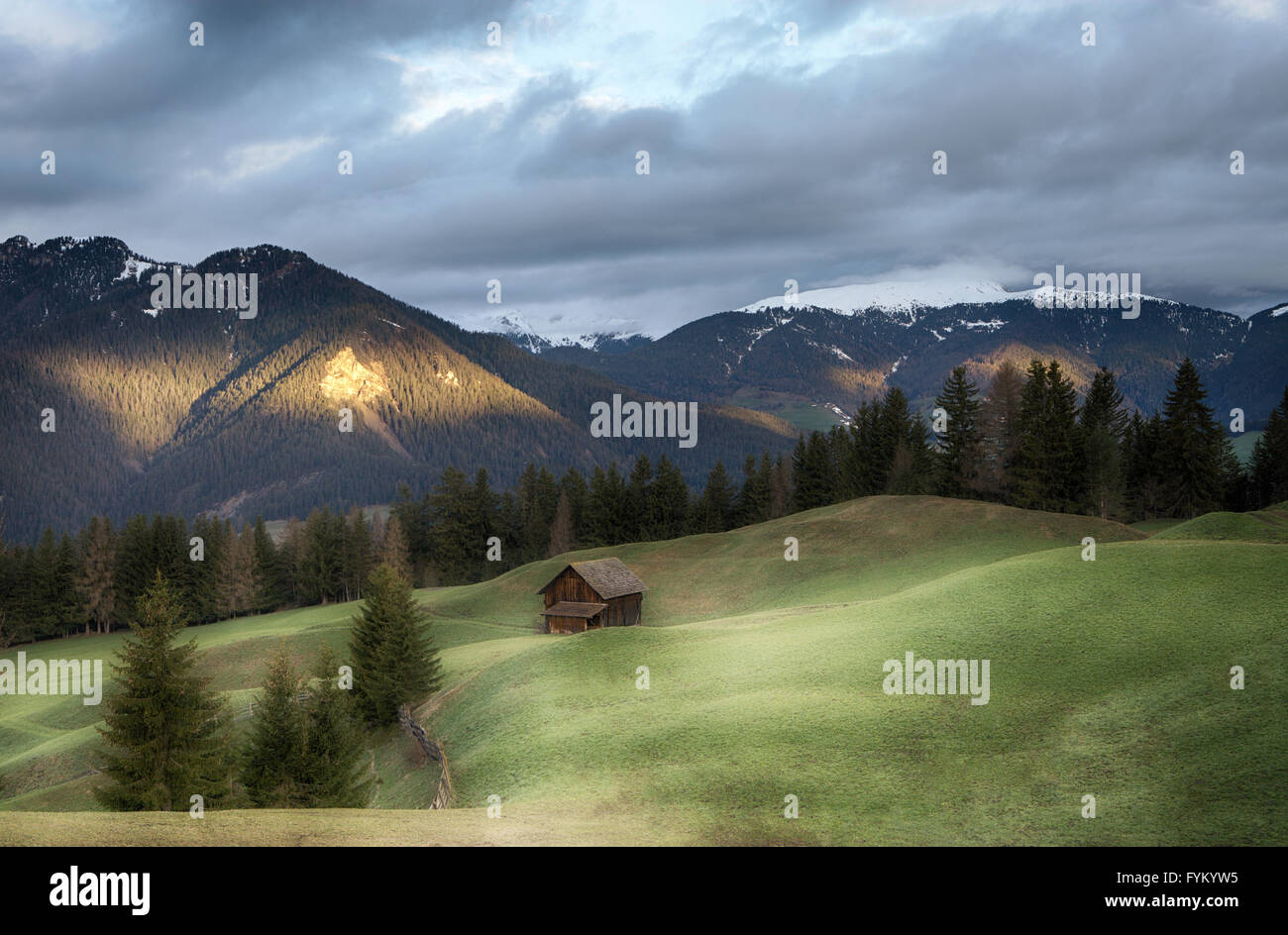 Cloudy sunrise over Dolomites mountains Stock Photo - Alamy