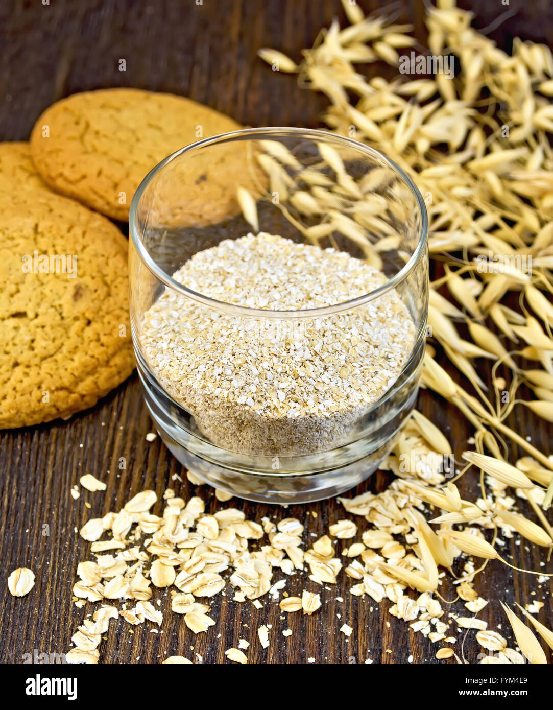 Bran small oat in a two glassful, oatmeal and ears, cookies on a ...