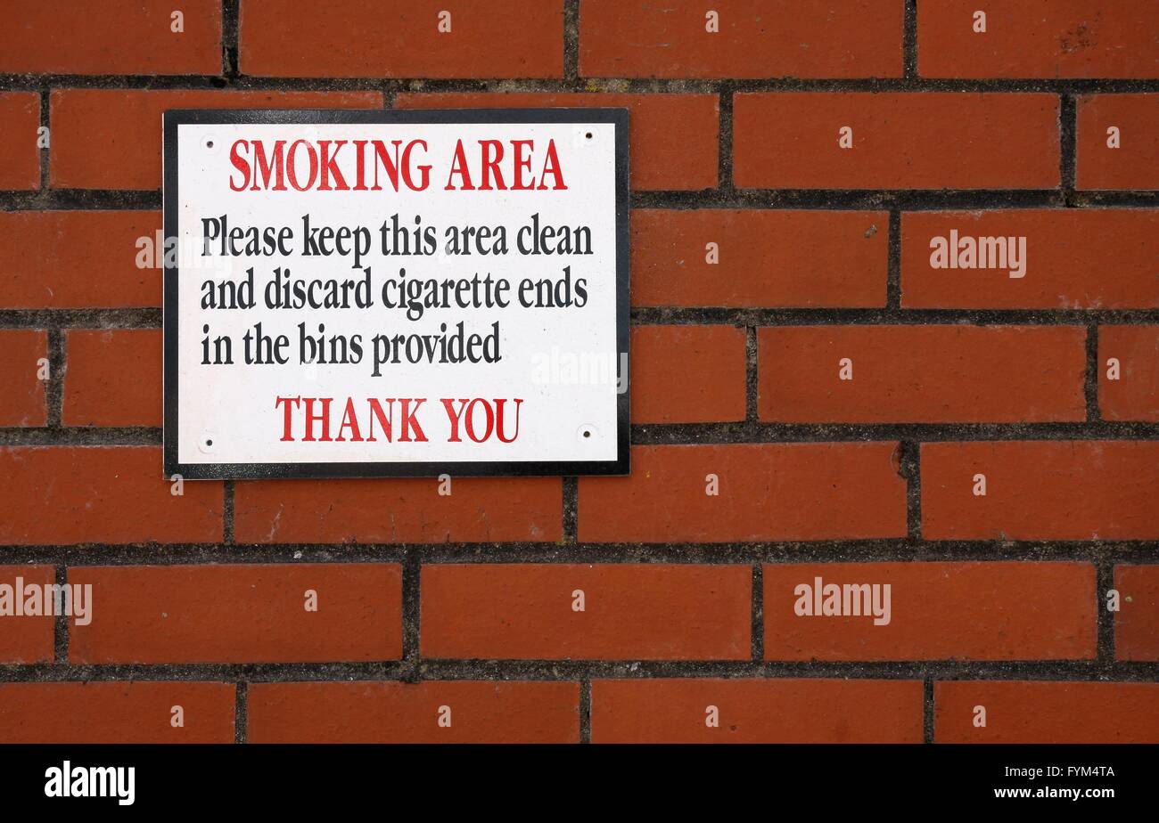 Smoking area sign on a brick wall Stock Photo - Alamy