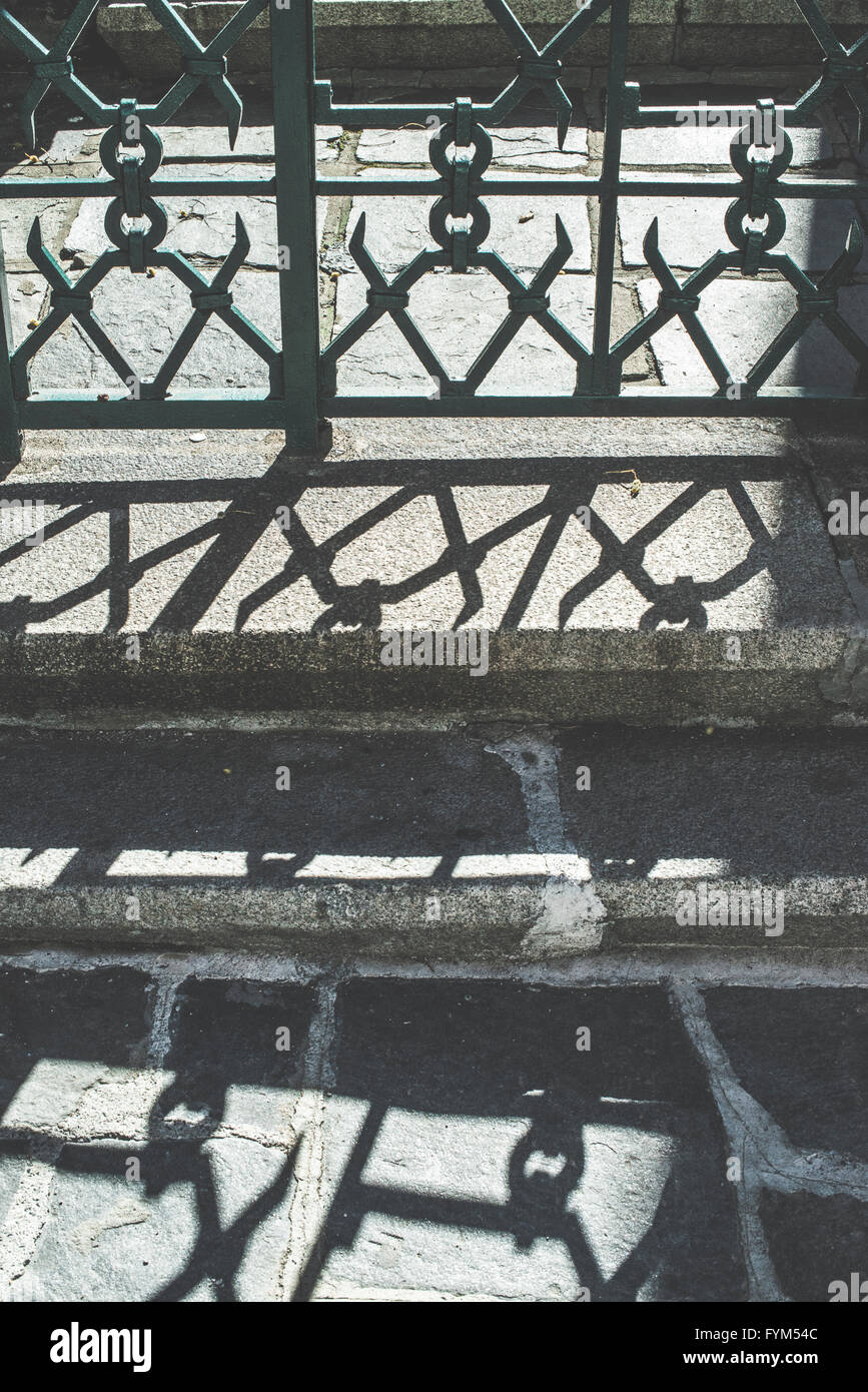 Metal ornamental fence and shadows Stock Photo - Alamy