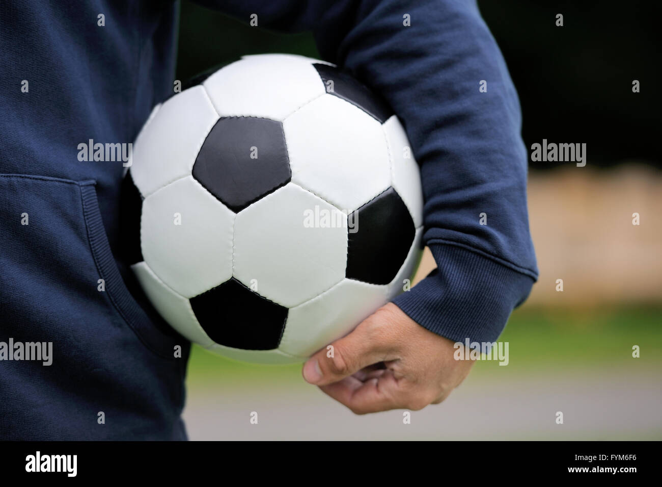 Hands holding soccer ball hi-res stock photography and images - Alamy