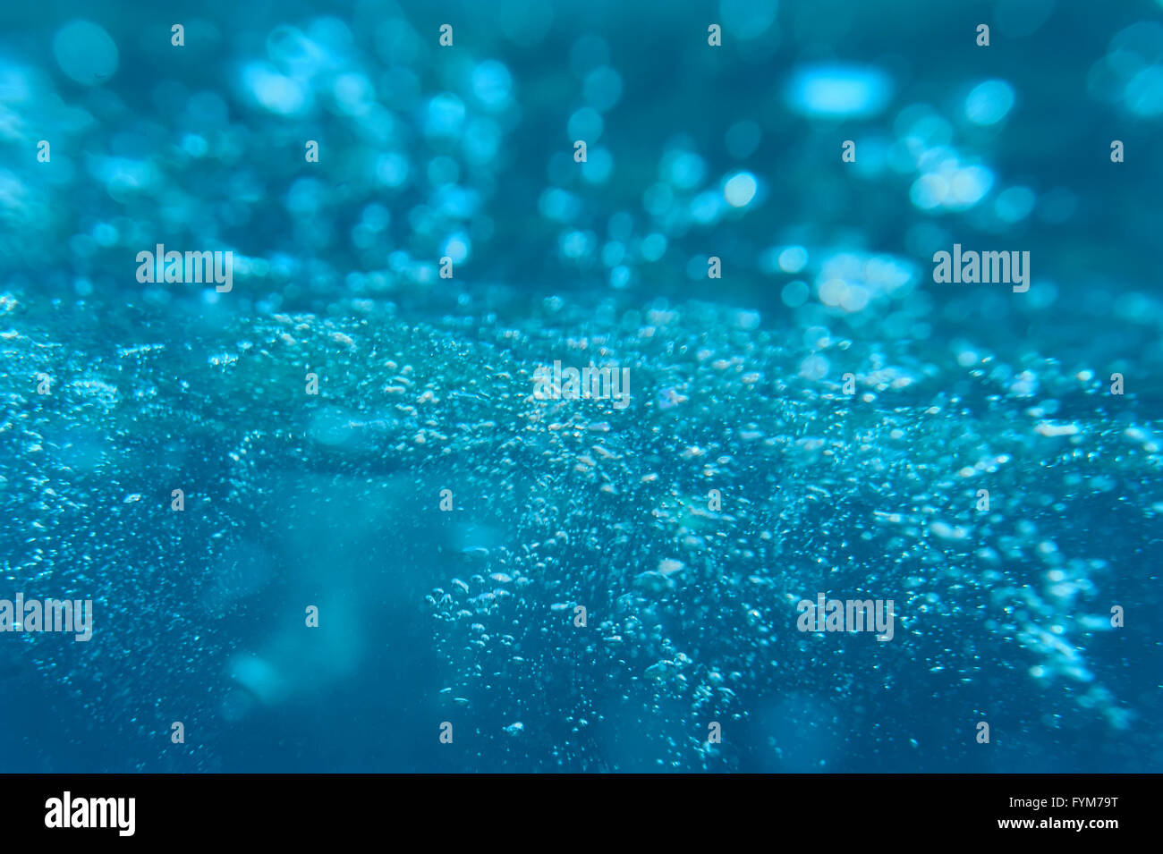 Ocean blue water bokeh background with bubbles Stock Photo - Alamy