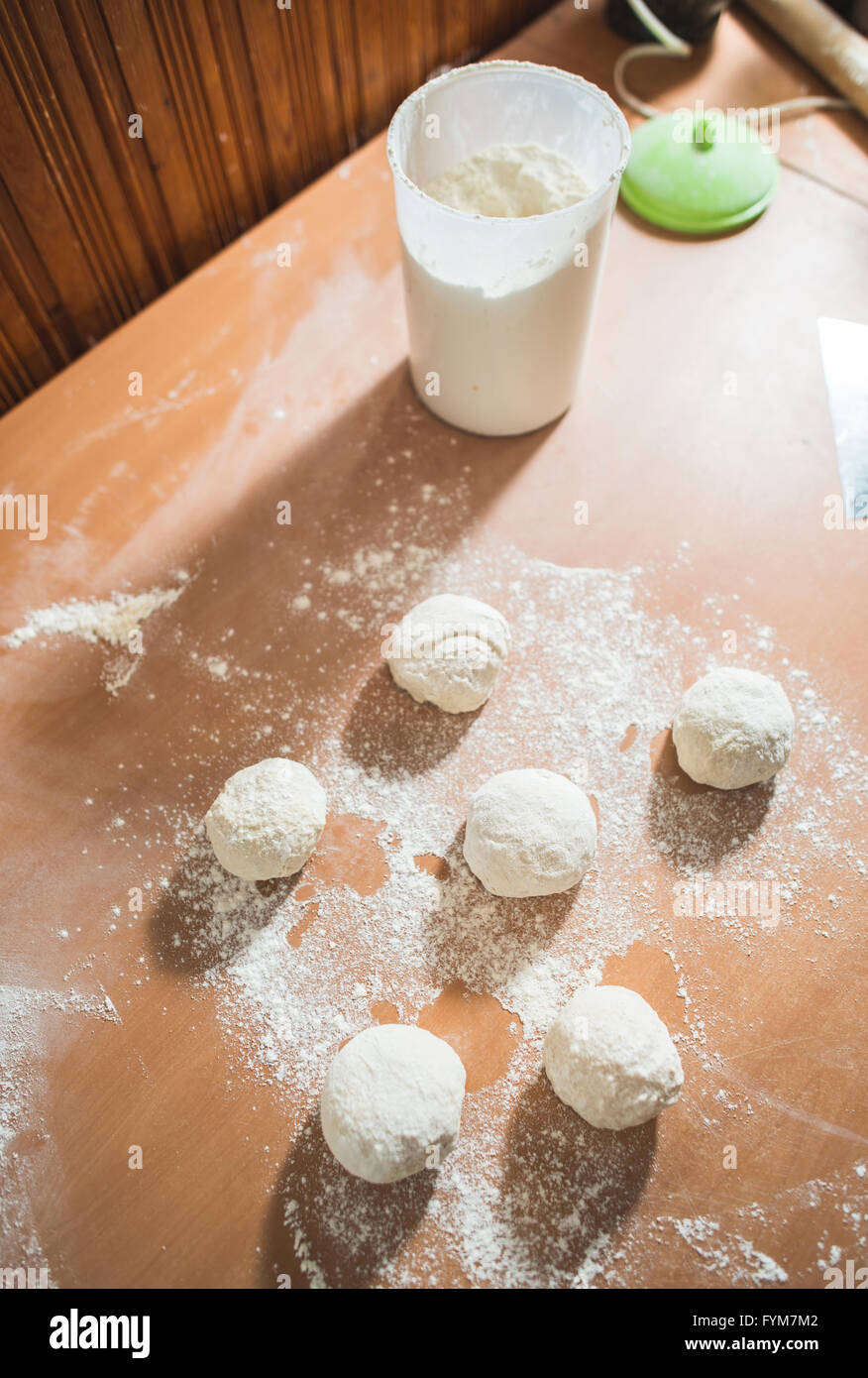 Making bread in a kitchen. Balls of dough Stock Photo - Alamy