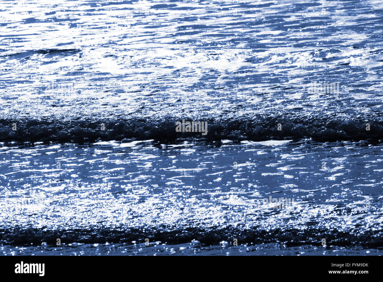 Small waves on beach roll hi-res stock photography and images - Alamy