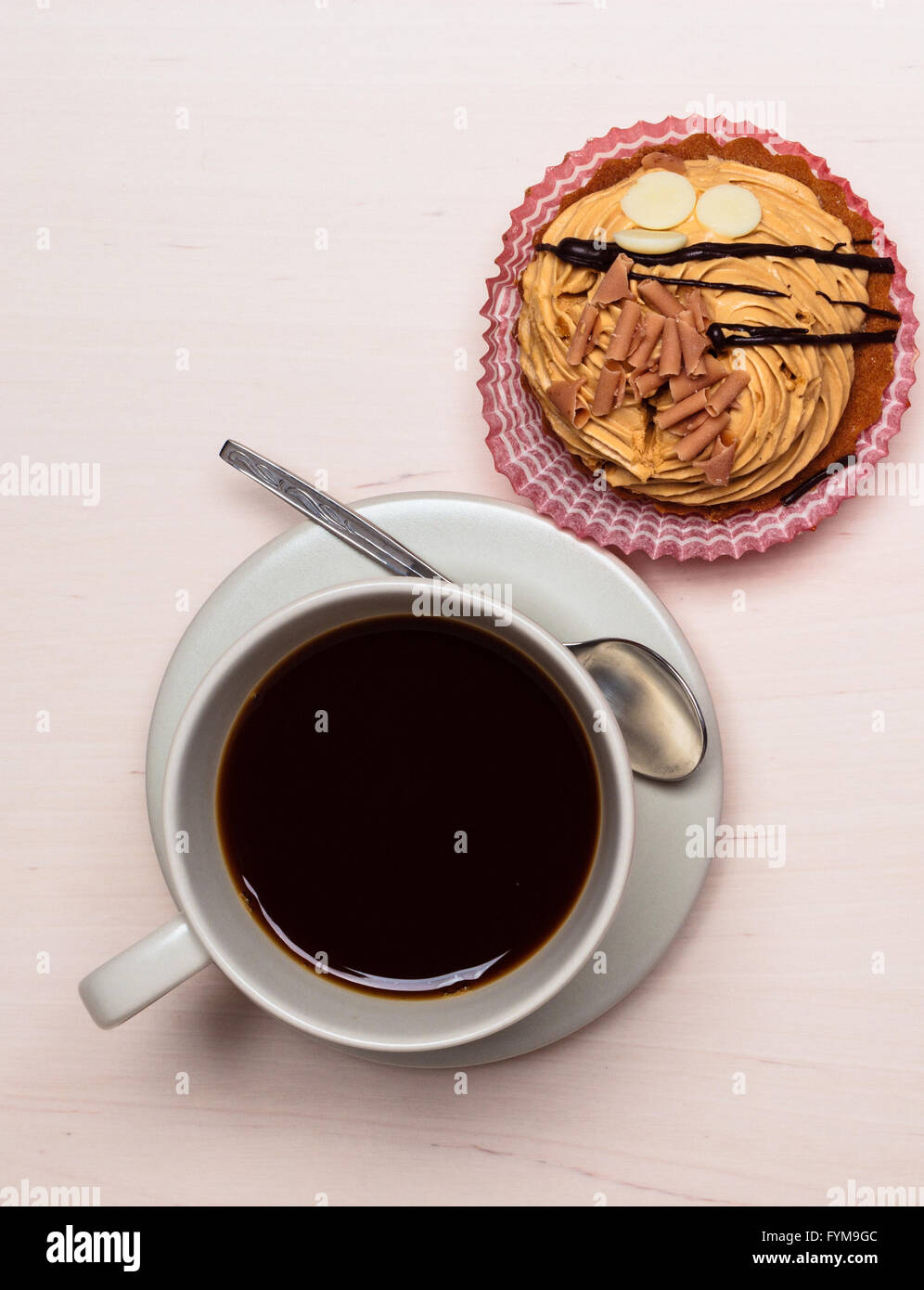 coffee cup and cake cupcake on wooden kitchen surface top view Stock ...