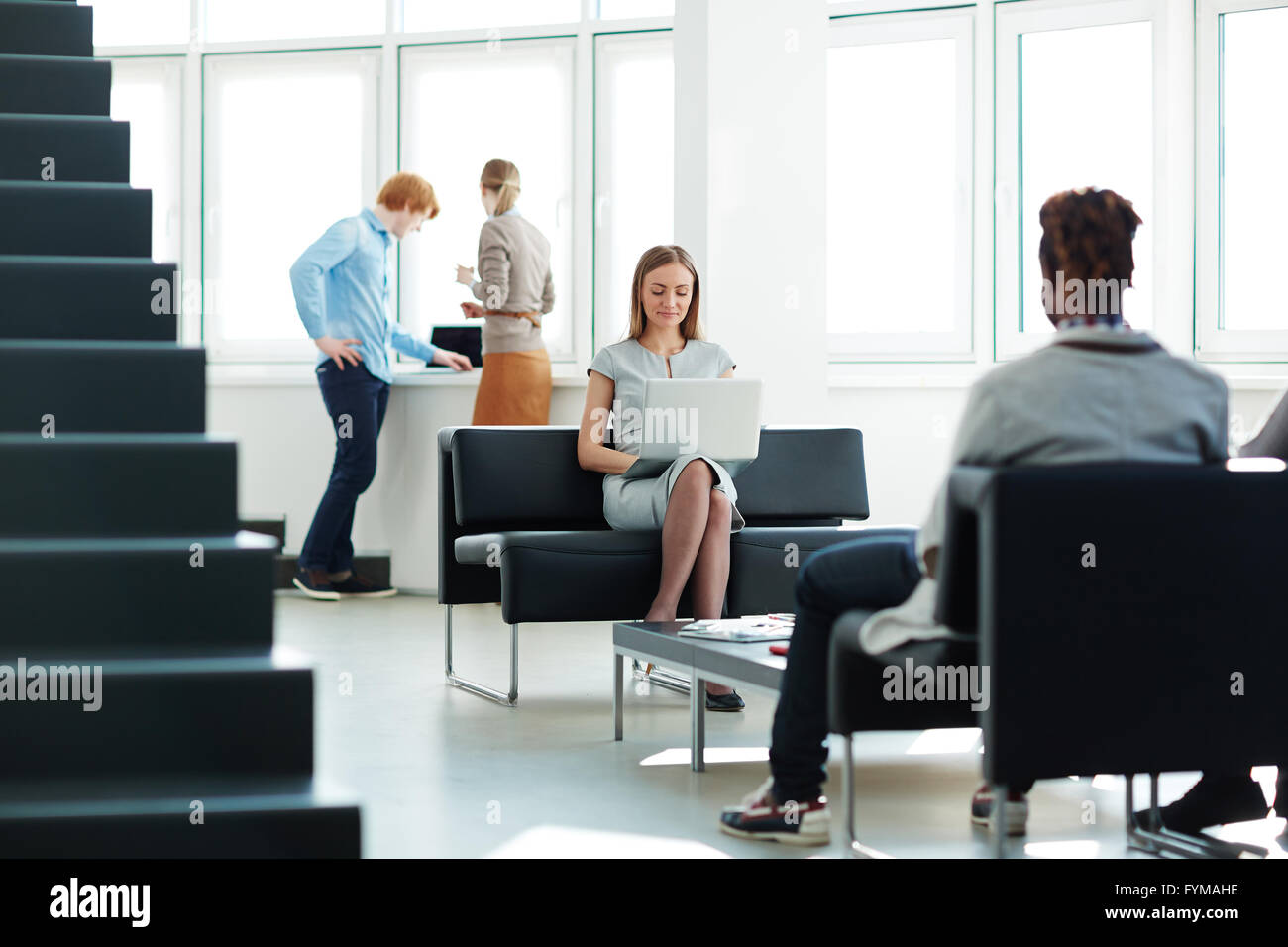 Employees in office Stock Photo - Alamy