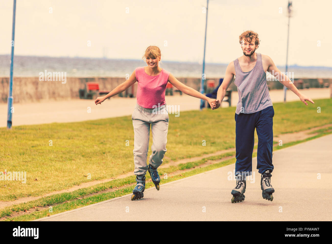 Active people modern couple exercise together and have fun. Relaxing ...