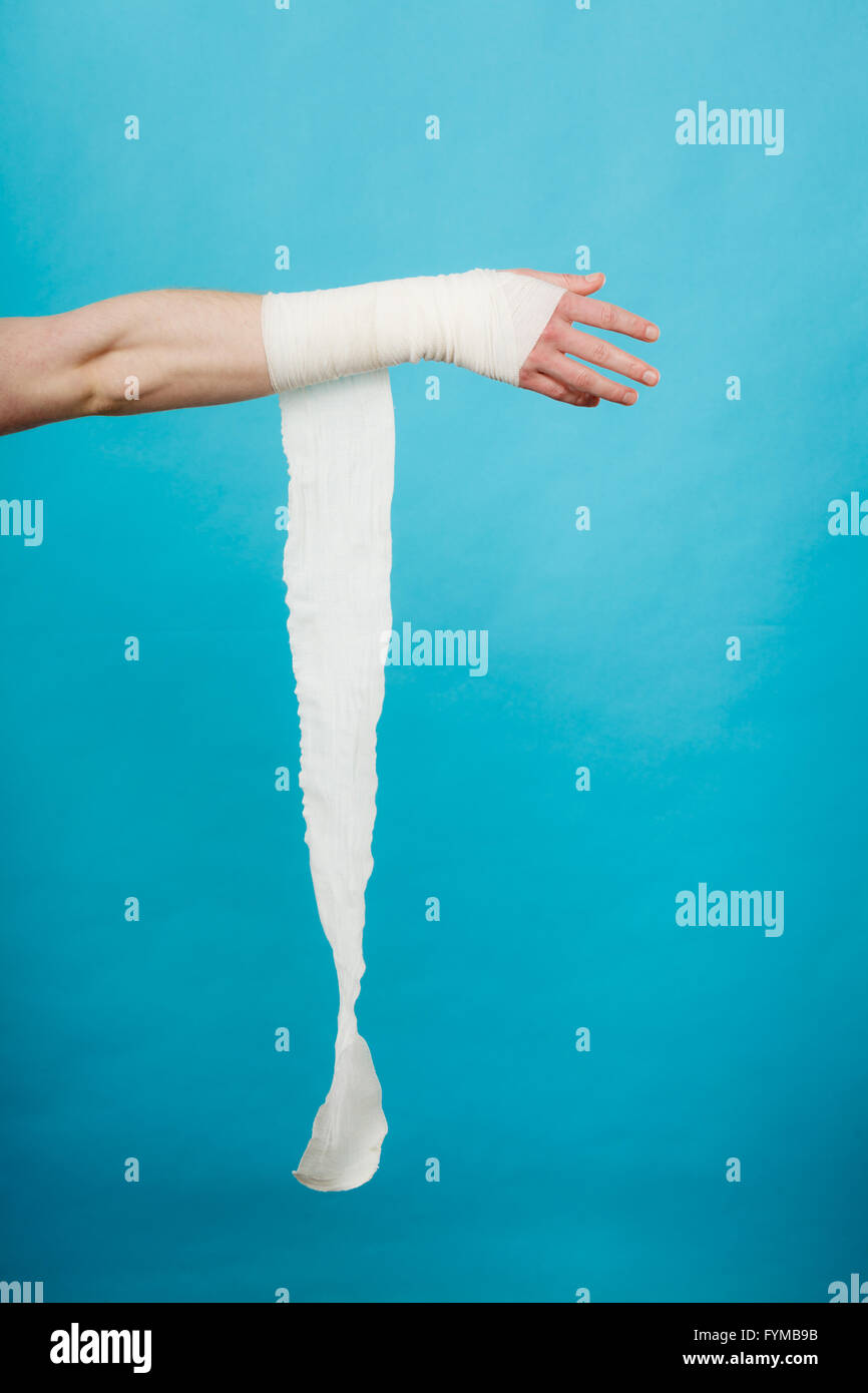 Fractures and dislocations concept. Male hand in white bandage. Helpful ...