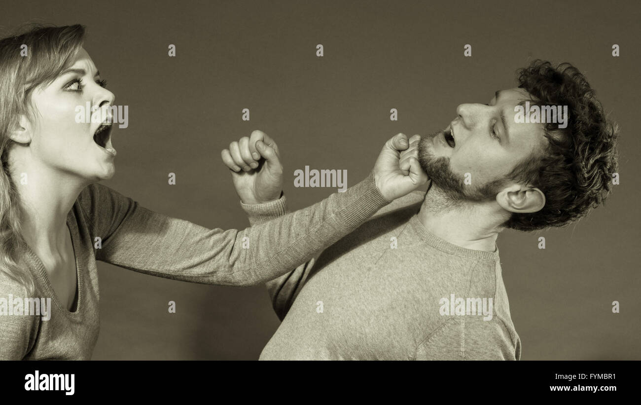 Violence against man. Aggressive woman yelling shouting on scared ...