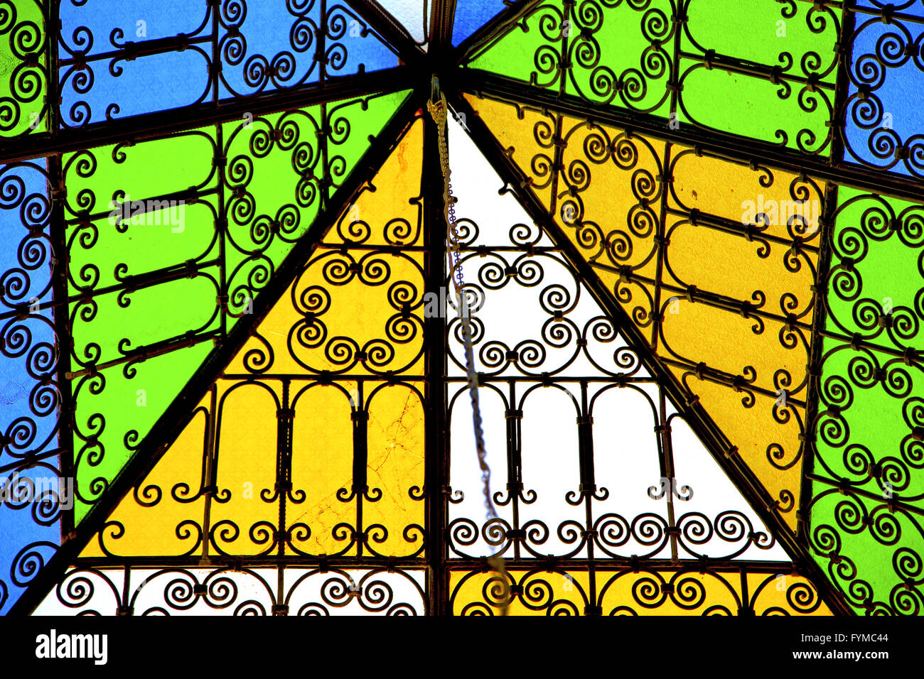 colorated glass and sun in morocco and light Stock Photo - Alamy