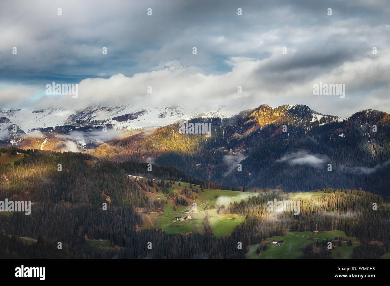 Cloudy sunrise over Dolomites mountains Stock Photo - Alamy