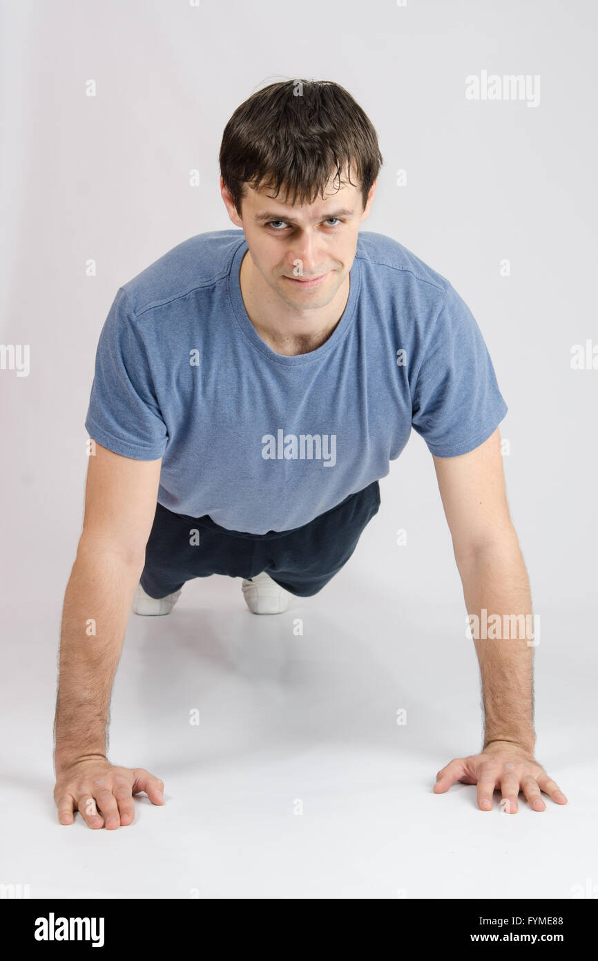 Young guy pushed off the floor Stock Photo - Alamy