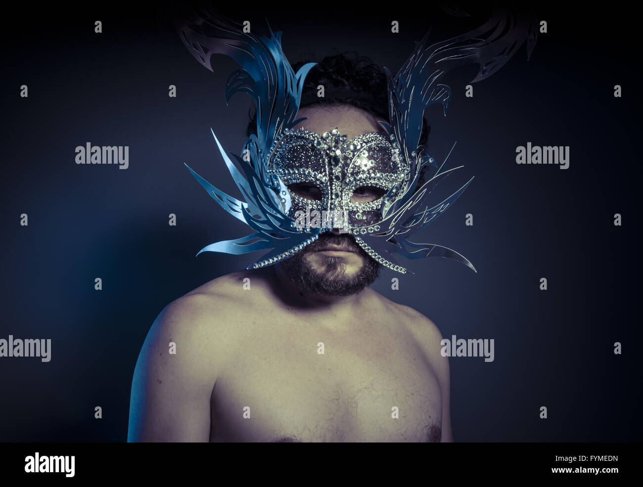 Party, bearded man with silver mask Venetian style. Mystery and ...