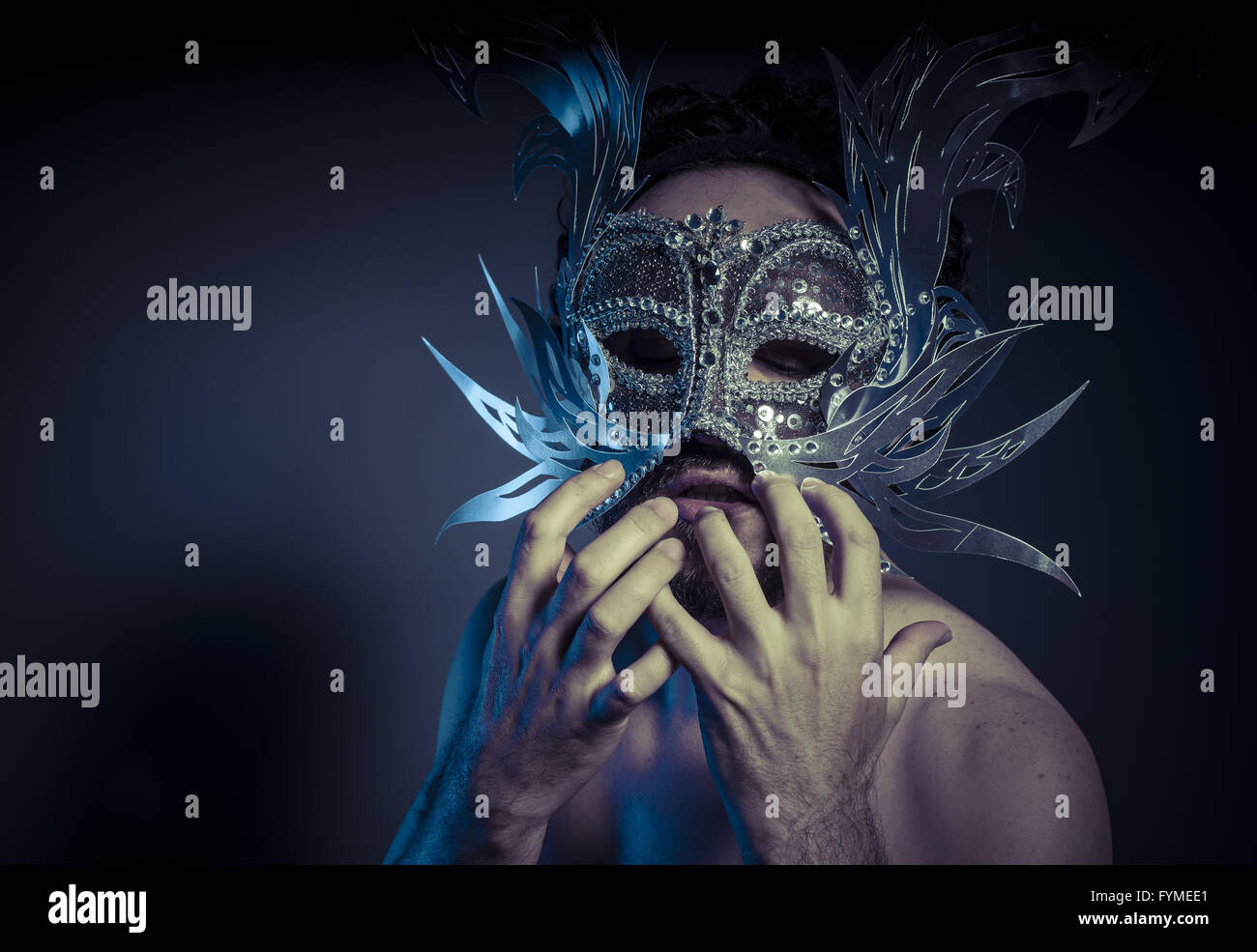 Costume, bearded man with silver mask Venetian style. Mystery and ...