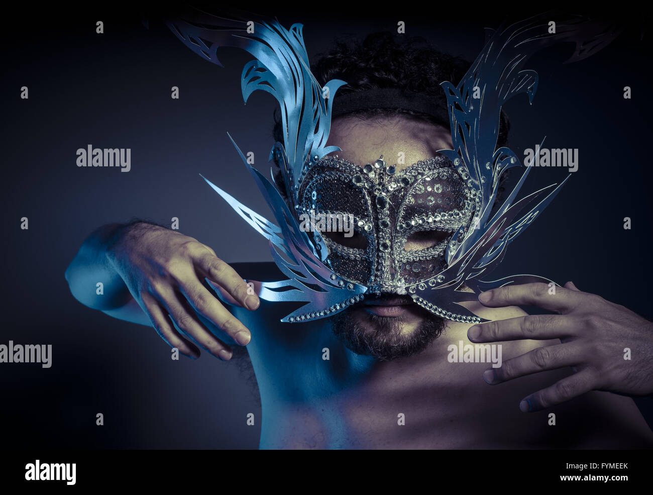 Woman with silver mask and blue costume hi-res stock photography and ...