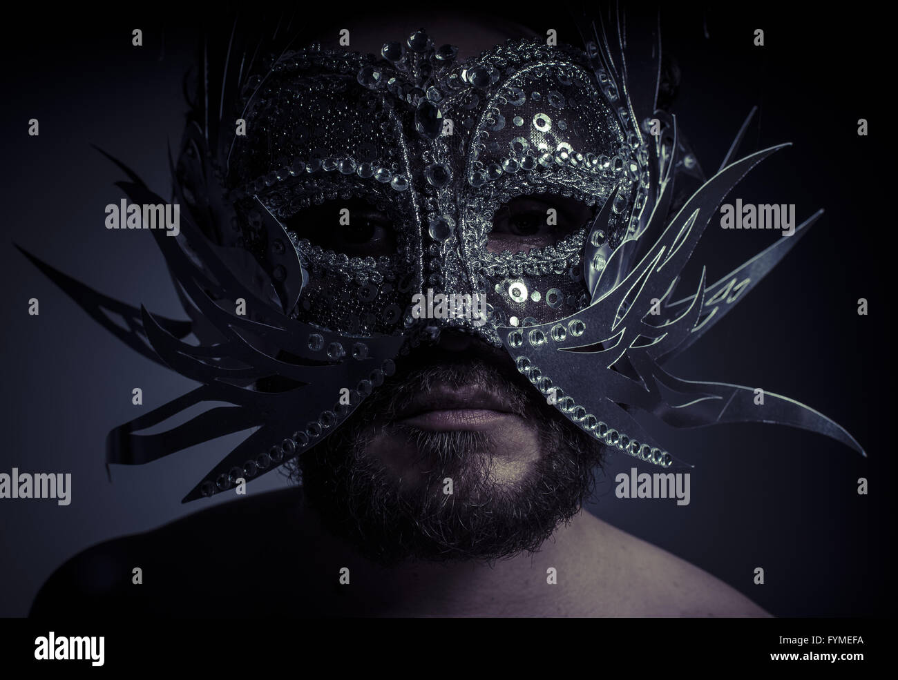 bearded man with silver mask Venetian style. Mystery and renaissance ...