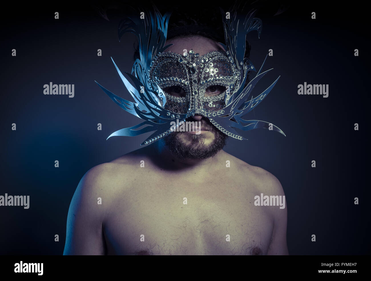 bearded man with silver mask Venetian style. Mystery and renaissance ...