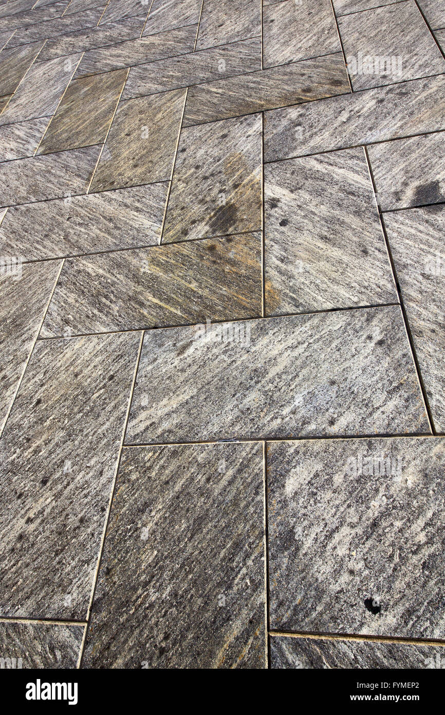 near mozzate street lombardy i pavement of a curch and wall marble ...