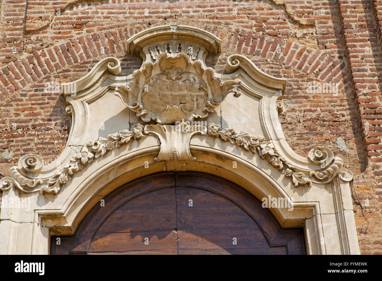 church door in italy lombardy column the Stock Photo - Alamy