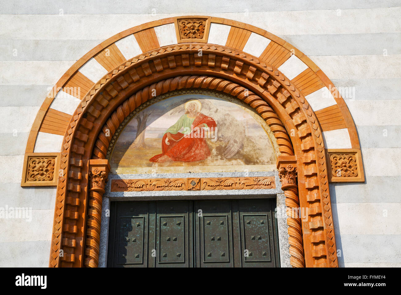church door in italy lombardy jesus Stock Photo - Alamy