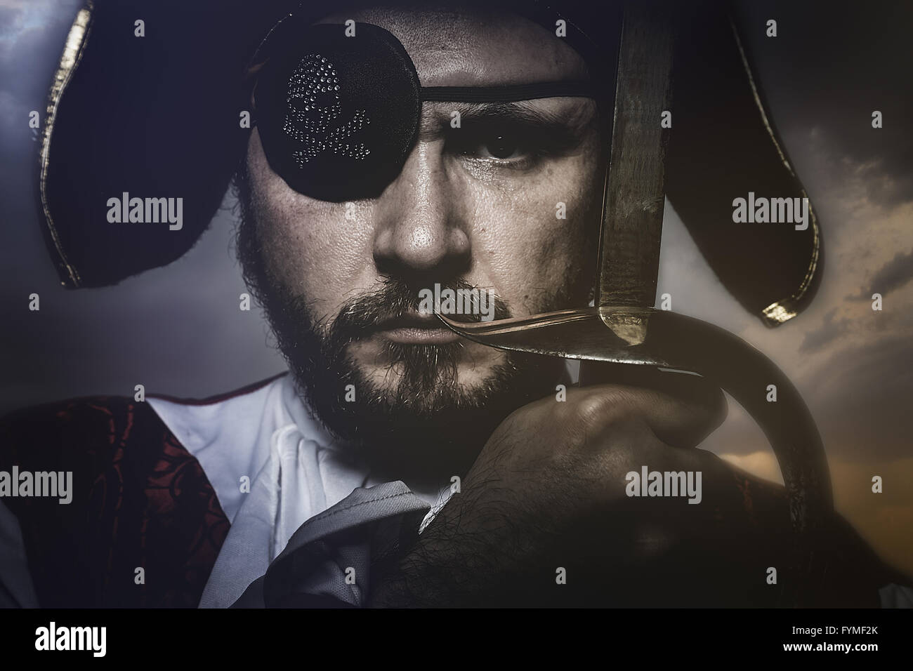 pirate with hat and eye patch holding a sword Stock Photo - Alamy