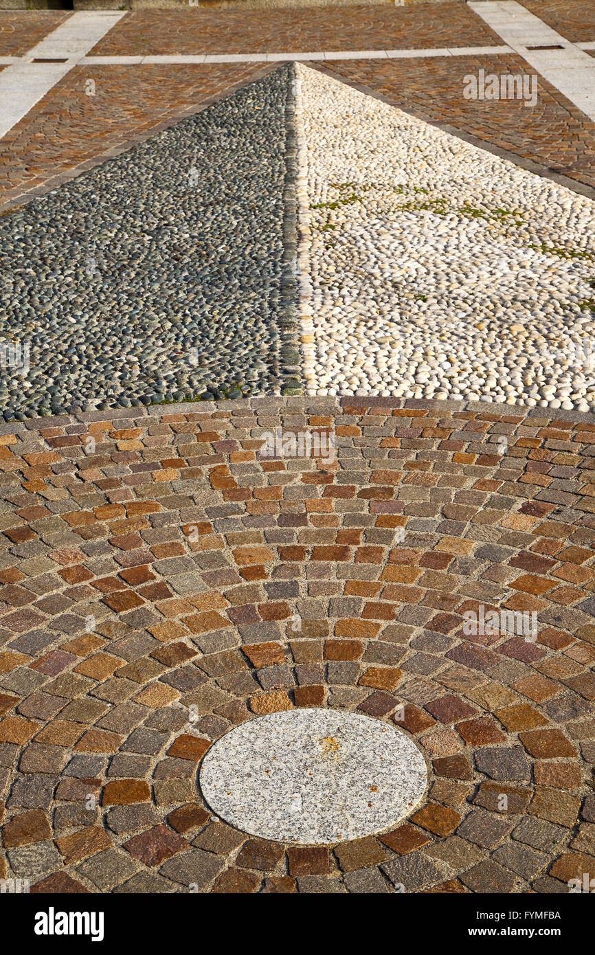 near mozzate street abstract pavement of curch and wall marble Stock ...
