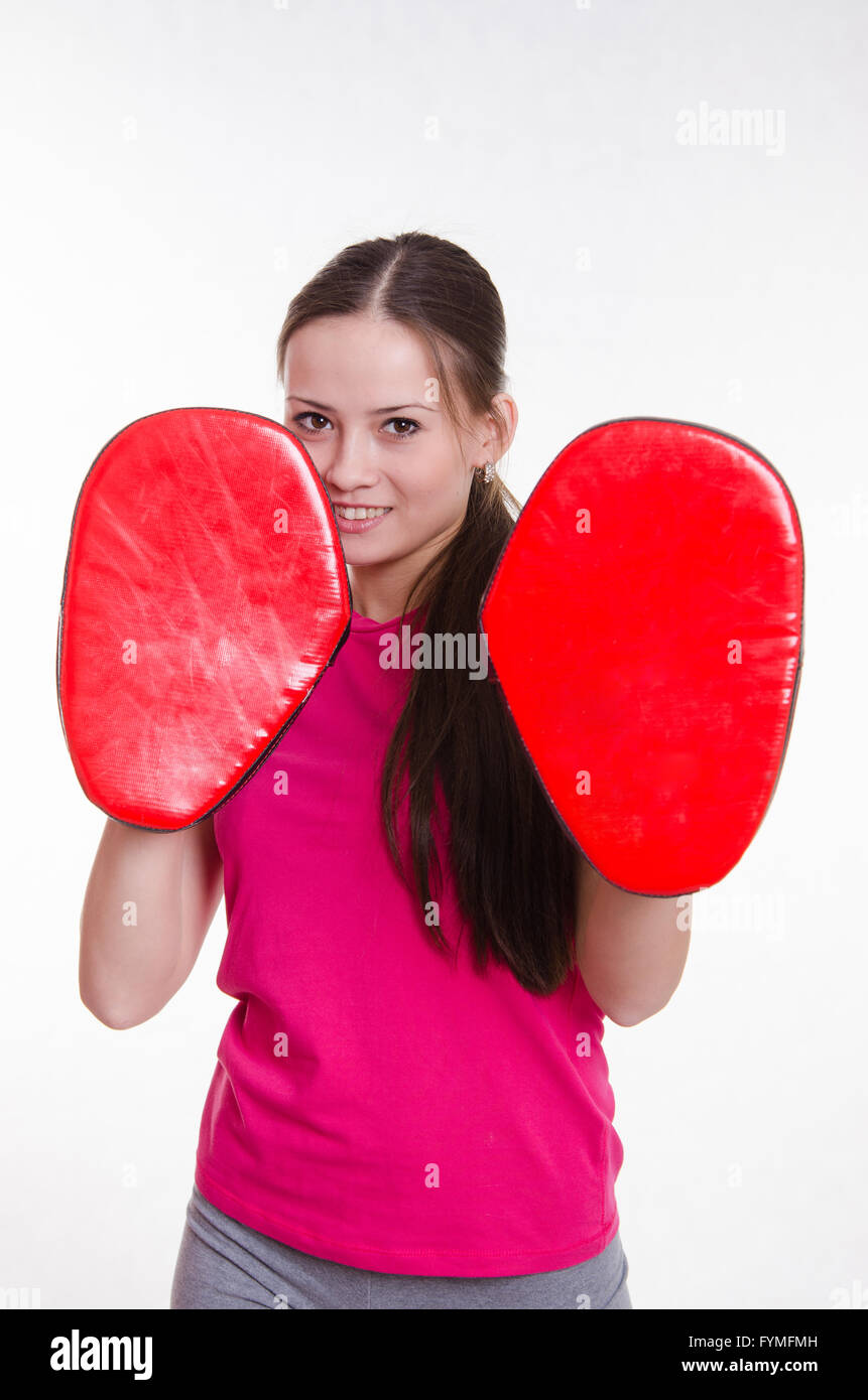 Athlete with boxing paws in the hands of Stock Photo - Alamy