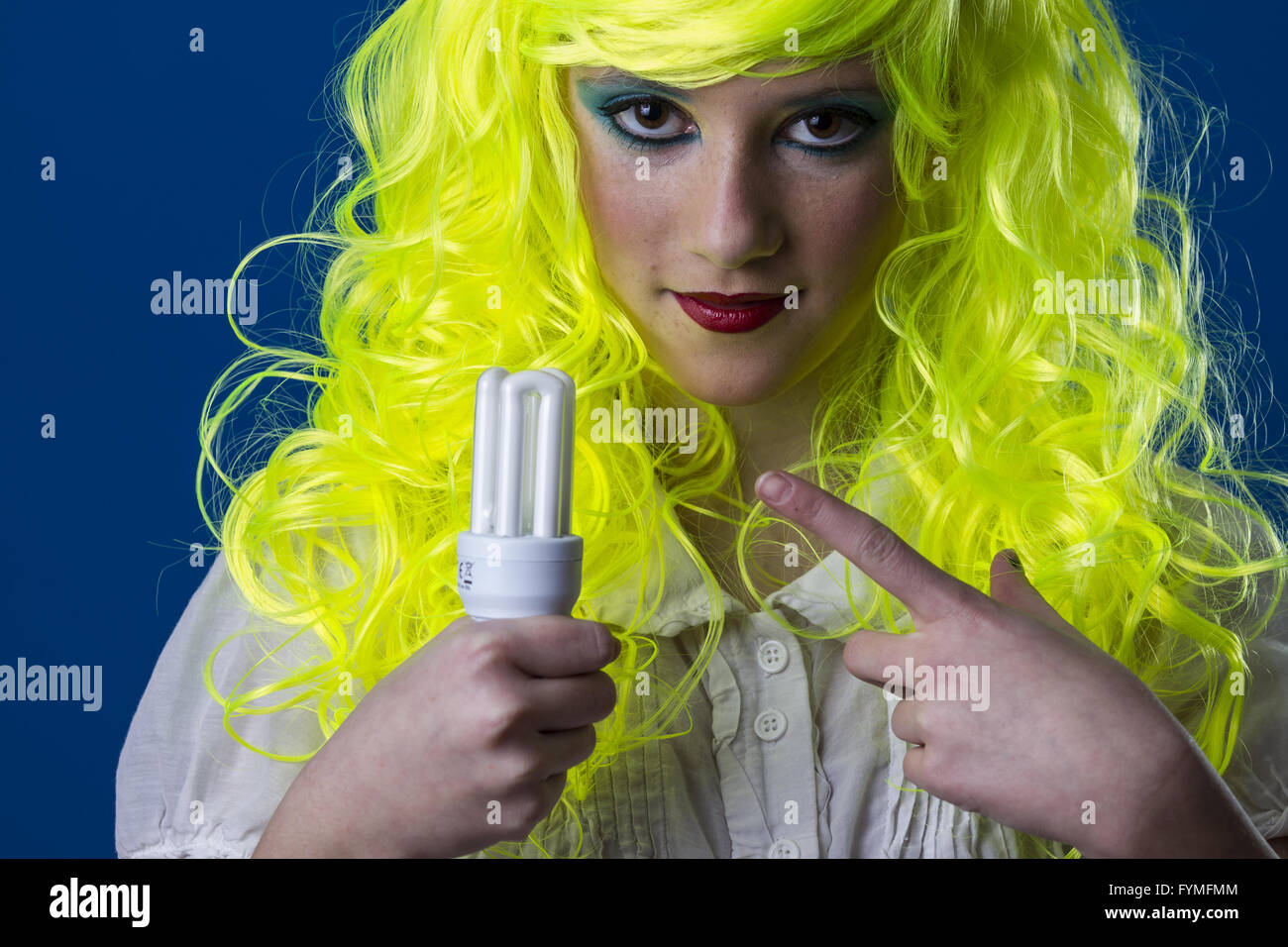 Ecology concept electricity, young girl with a light bulb in hand Stock ...