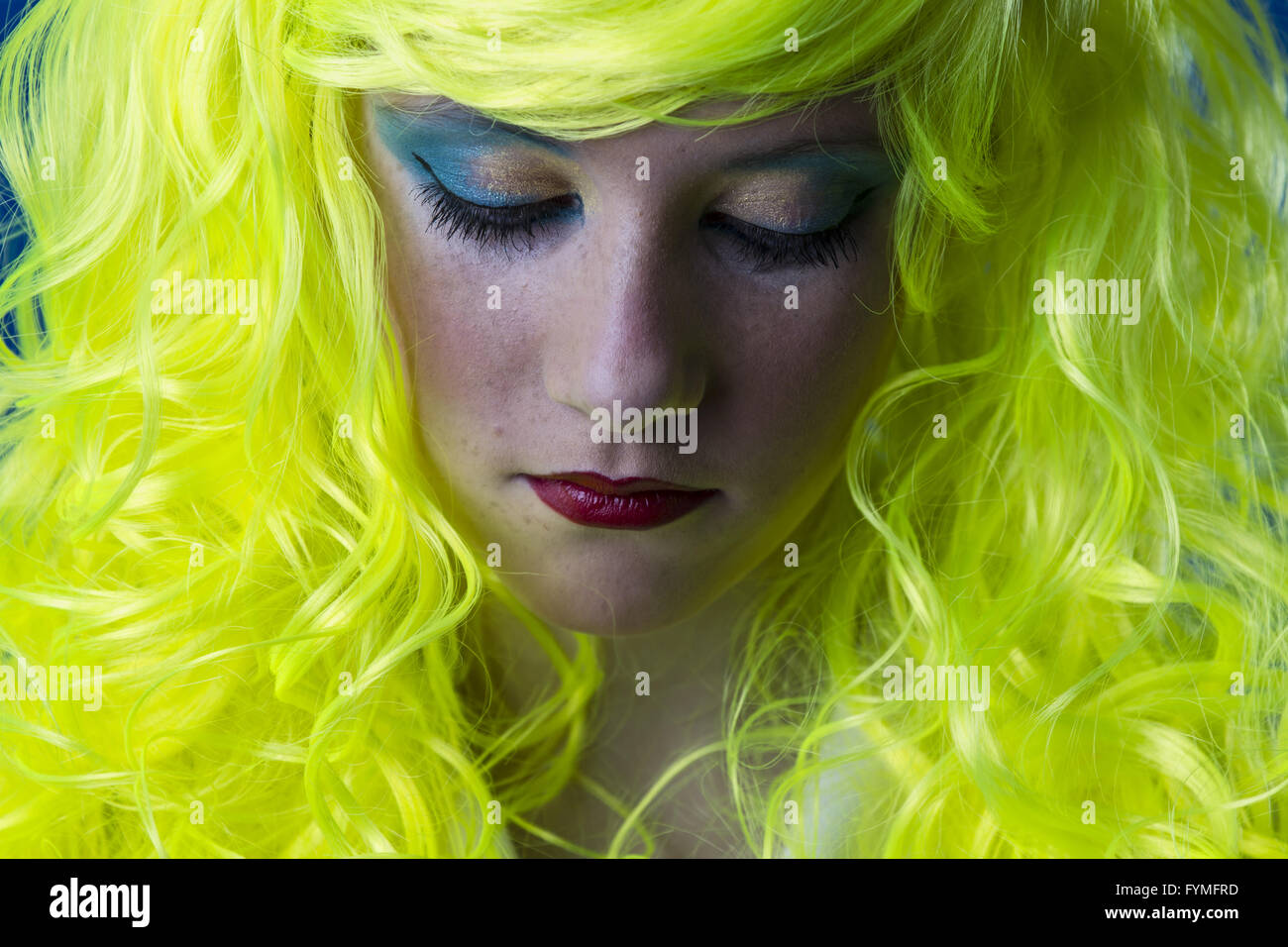 Sad, young girl with yellow hair Stock Photo - Alamy