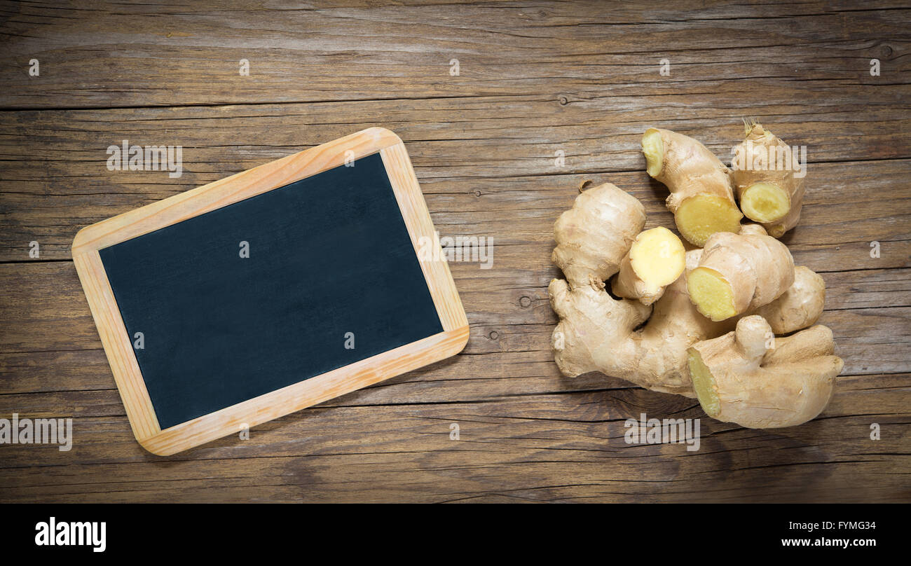 fresh raw smell Ginger and blackboard on wooden table Stock Photo - Alamy